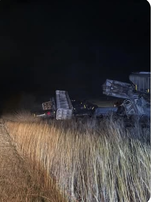 Railroad crews working scene of train derailment near Perry in rural ...